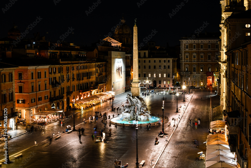 View from a window overlooking Piazza Navona at night showing the ...