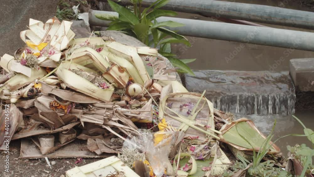 Close Up of Canang Sari Items Trash lying On Bali Road. Traditional ...