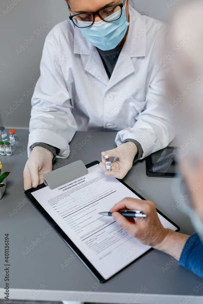 Female doctor explaining to her patient the benefits and risks of the ...