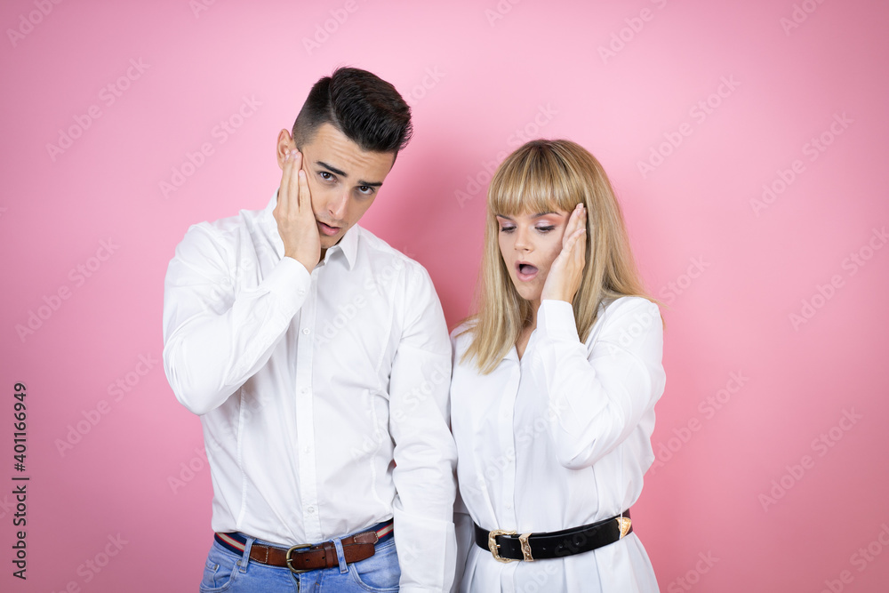 Young couple of girlfriend and boyfriend over isolated pink background ...