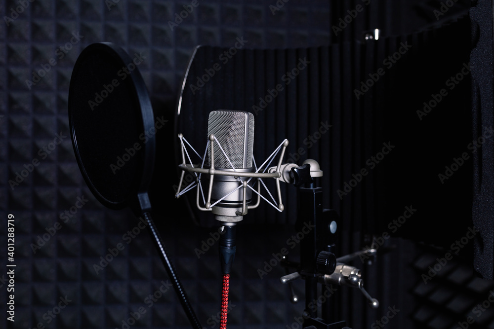 Contemporary metal microphone with wire placed on background of ...