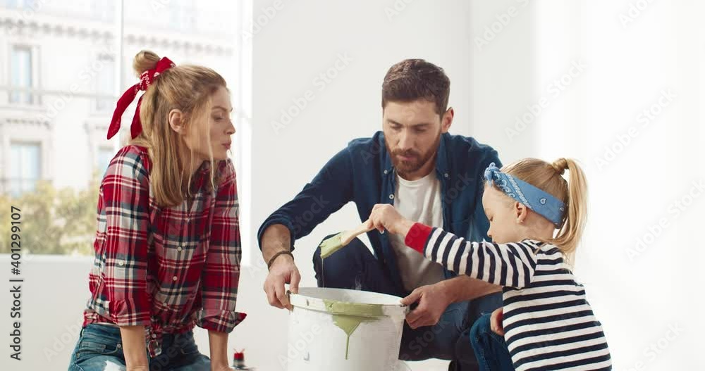 Happy Caucasian mother and father in new apartment with little cute ...