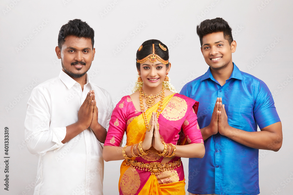 Happy South Indian traditional family giving greeting on white. Stock ...