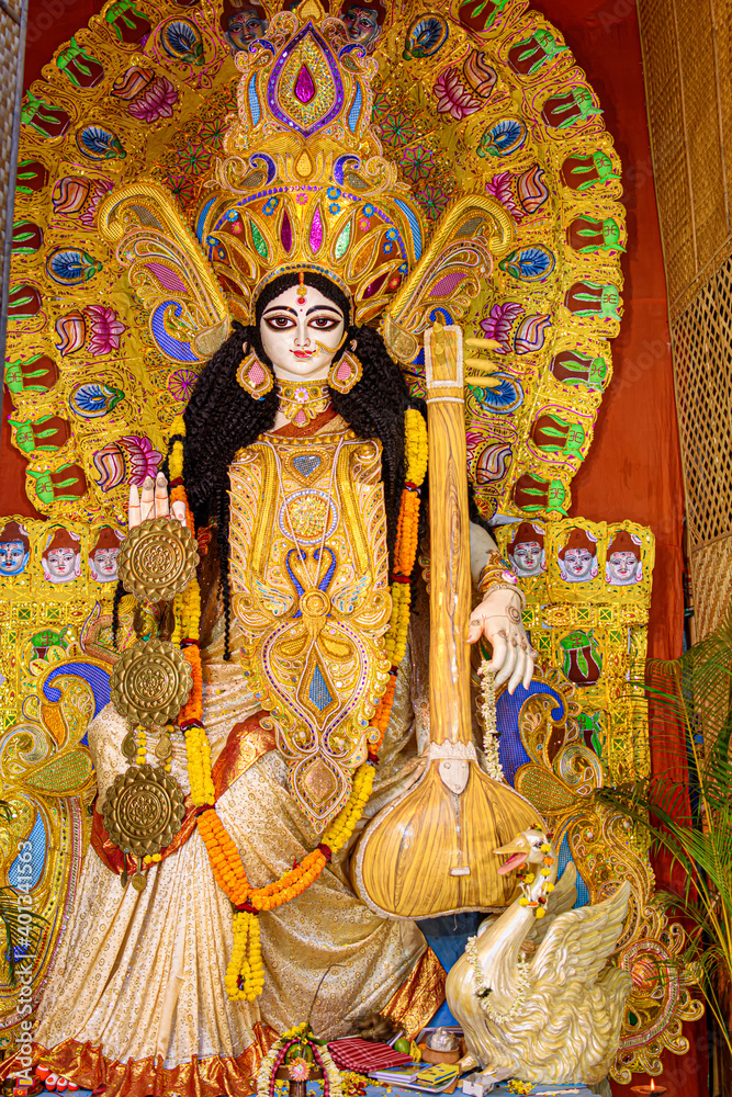 Idol of Goddess Devi Saraswati at a decorated puja pandal in Kolkata ...