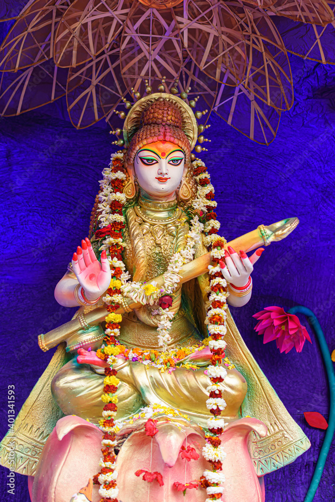 Idol of Goddess Devi Saraswati at a decorated puja pandal in Kolkata ...