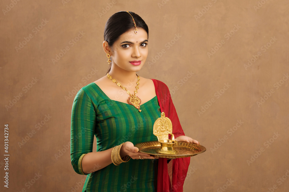 Hindu Indian young women holding Deepam in hands. ( Kamatchi vilakku ...