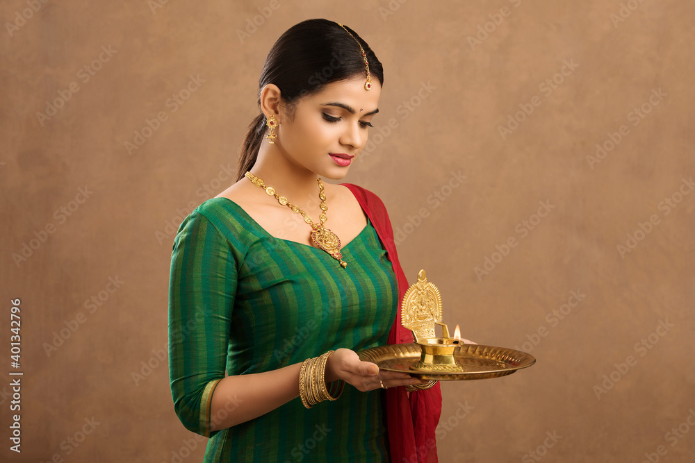 Hindu Indian young women holding Deepam in hands. ( Kamatchi vilakku ...