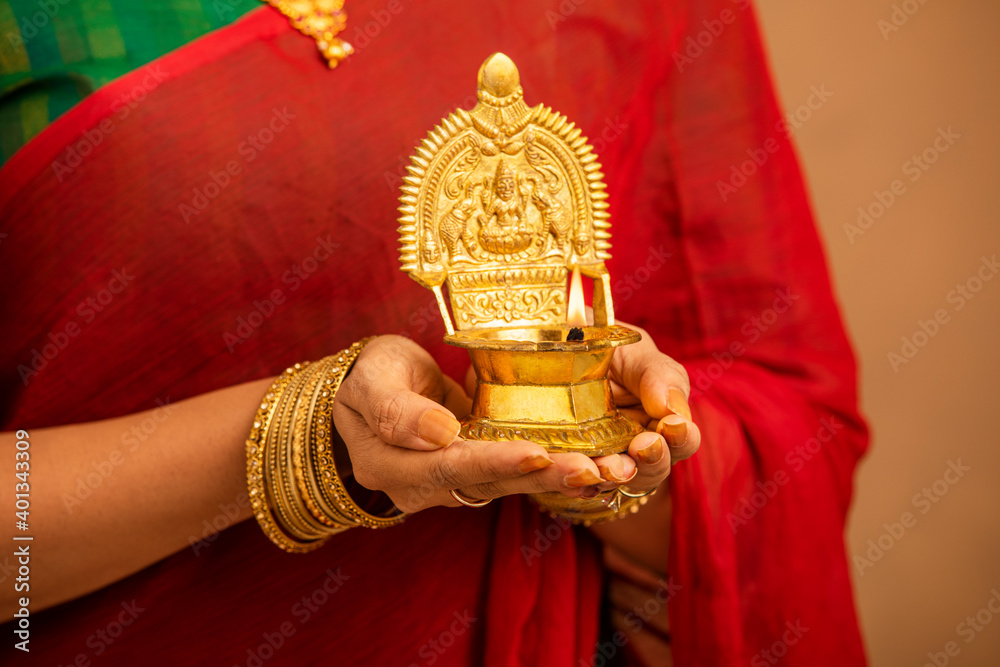 Hindu Indian young women holding Deepam in hands studio shot ...