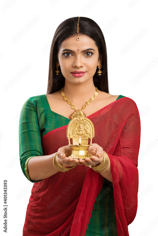 Hindu Indian young women holding Deepam in hands. ( Kamatchi vilakku ...