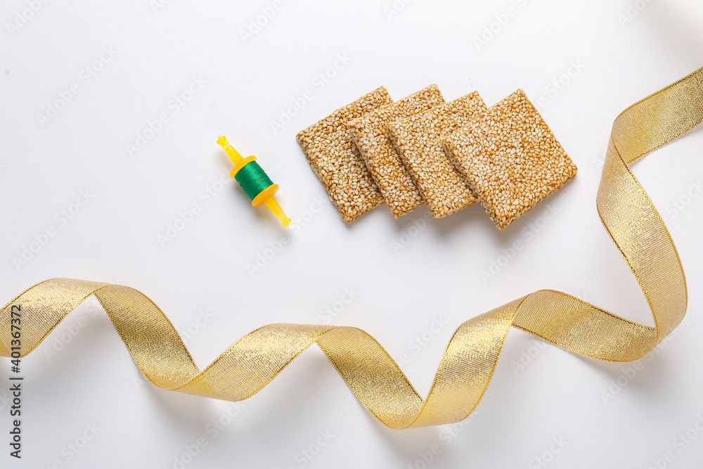 indian sweet chikki made from sesame seed with colorful paper kite for ...