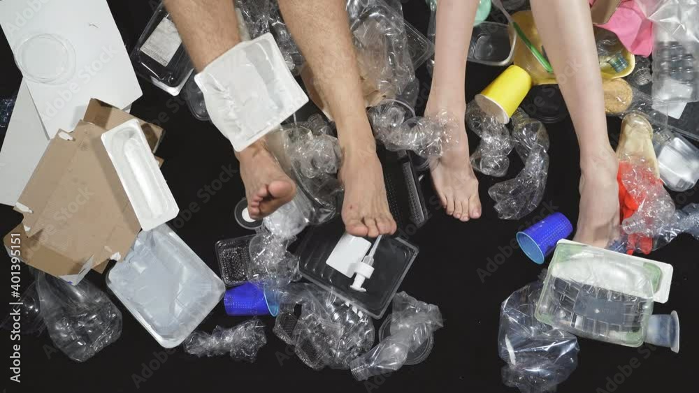 man and woman are comfortable to live in such dirty place full of ...