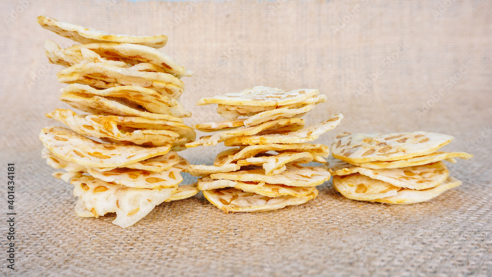 Stack of irregular shape crunchy keripik tempe or traditional tempeh ...