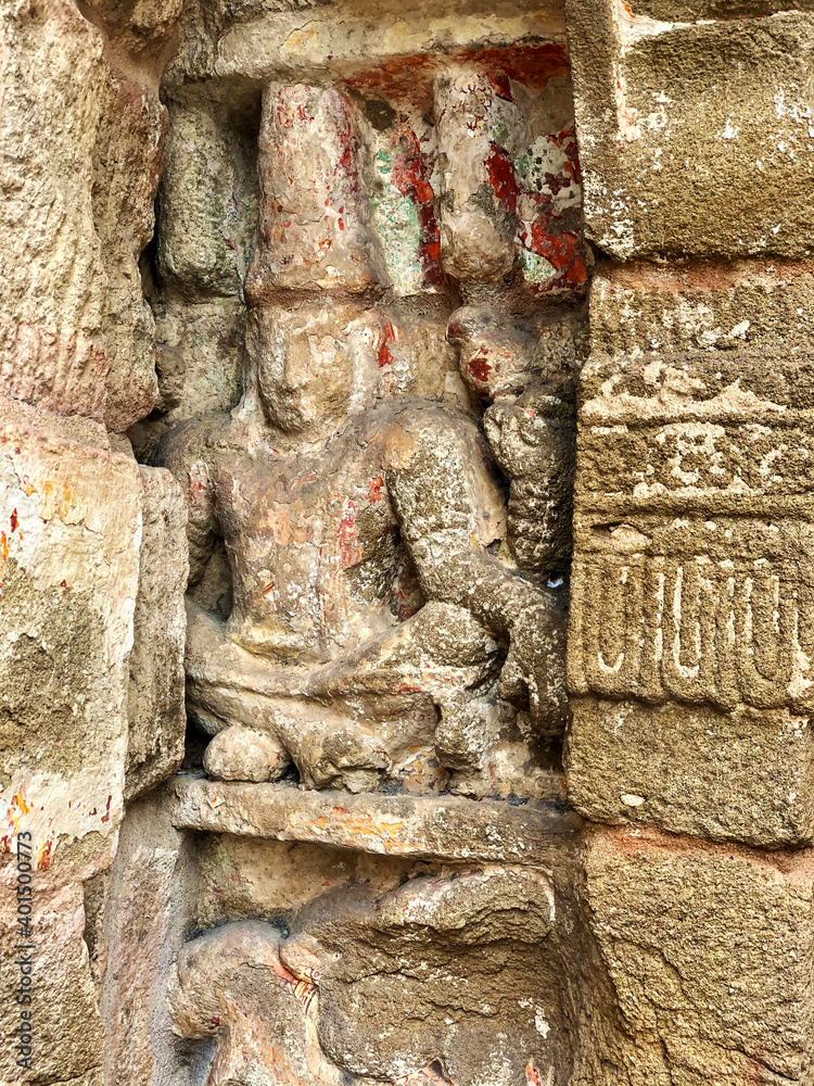 Hindu God deity statue. Ancient sandstone carved historical Hindu God ...