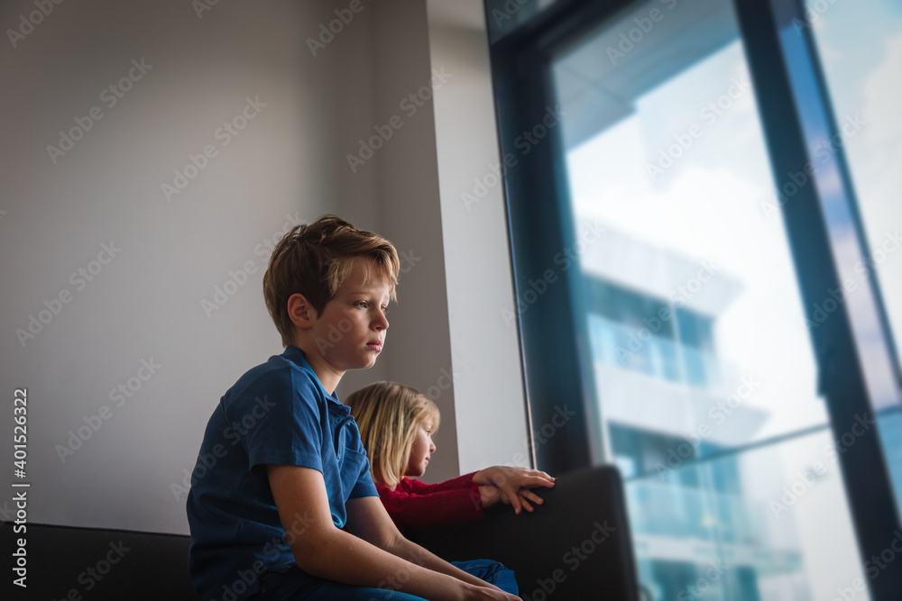 sad boy and girl stay home, family on quarantine, social distancing for ...