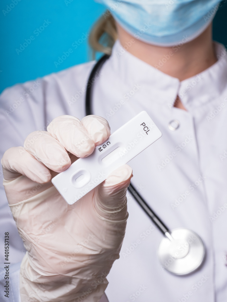 Doctor or medtech shows rapid laboratory COVID-19 test to detect IgM ... Doctor or medtech shows rapid laboratory COVID-19 test to detect IgM ...