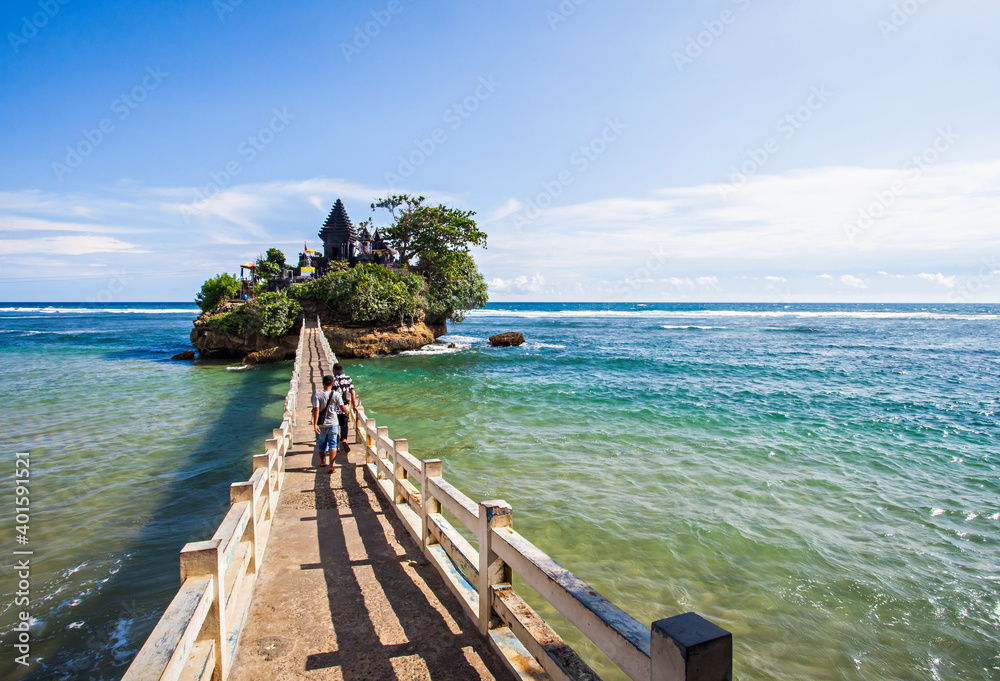 A hinduism temple in a small island in Bale Kambang beach, a tourist ...