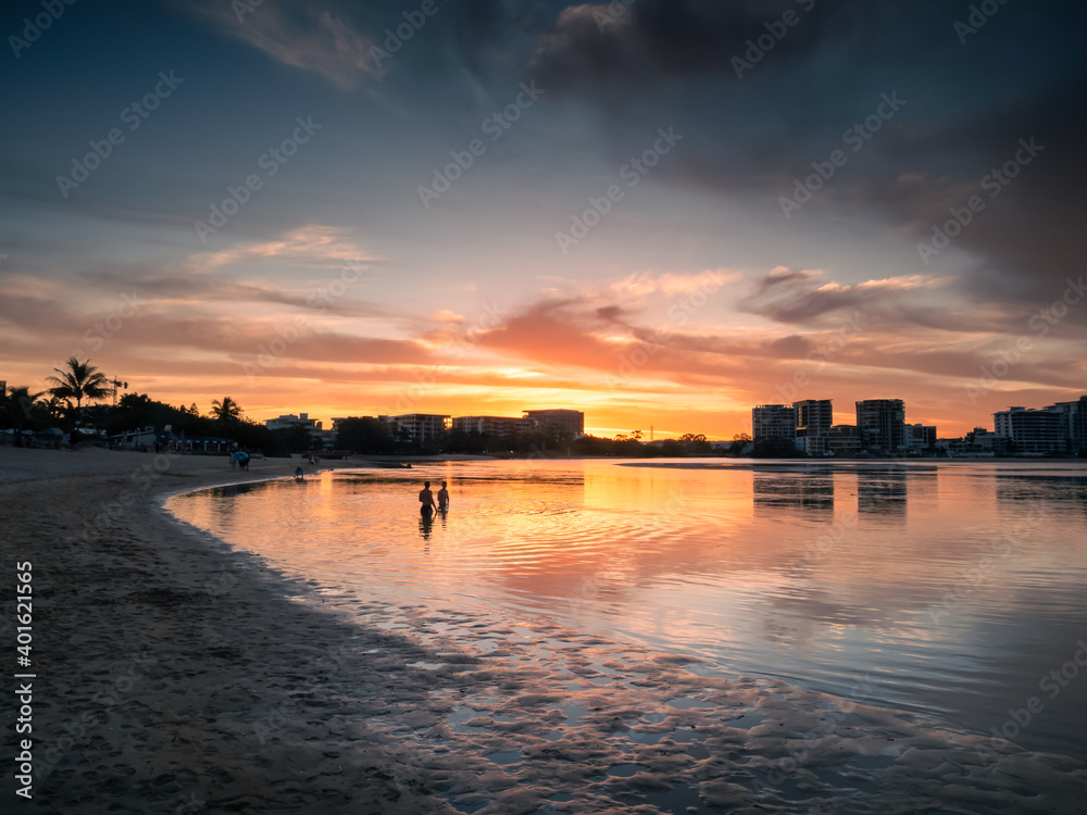 Beautiful Riverside Sunset with Reflections and Two People in ...