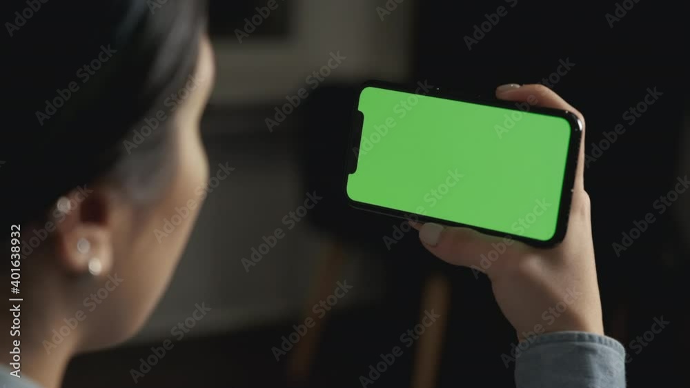 Close up Horizontal hands holding smartphone with green screen. Green ...
