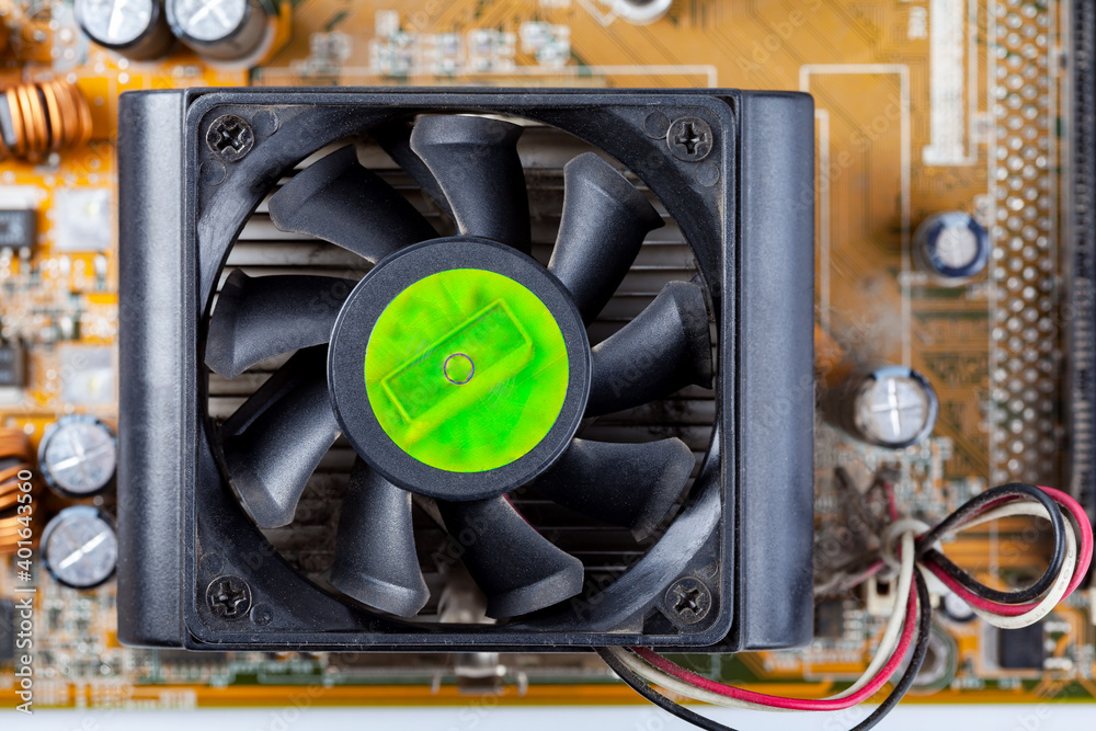 Simple basic CPU chipset fan, processor air cooler on a motherboard top ...