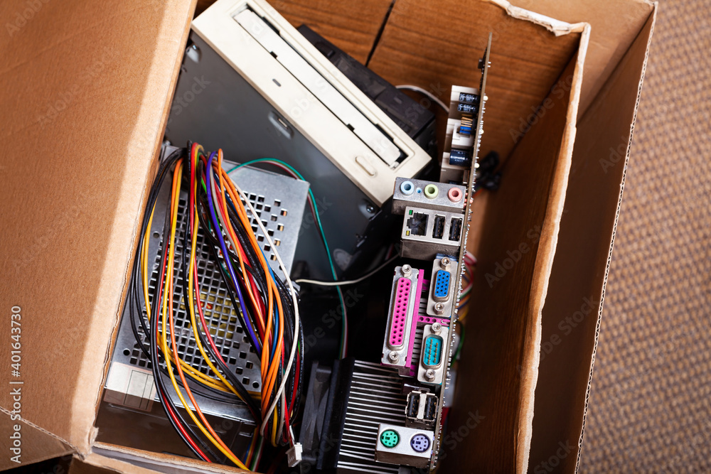 Electronic waste, cardboard box package full of e-waste, old dated ...