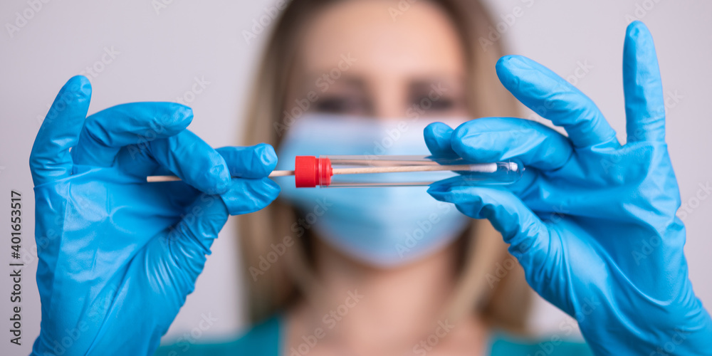 Nurse with facemask holding Coronavirus COVID-19 swab test kit, PPE ...