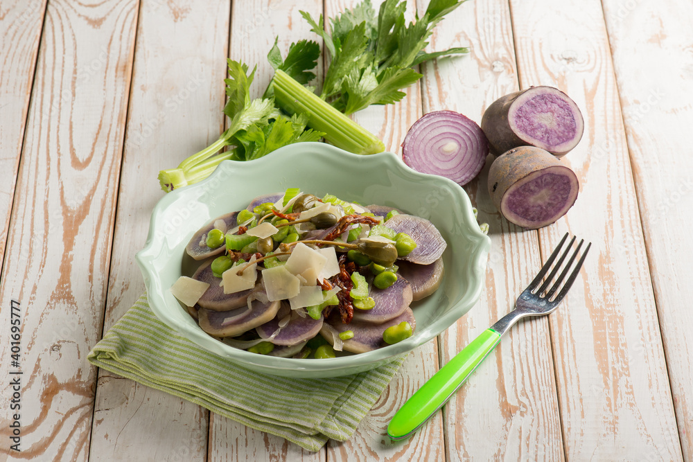 vegetables salad with purple potatoes broad beans sliced parmesan ...