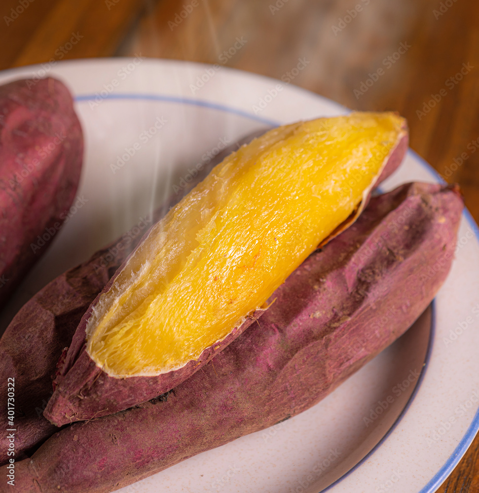 Japan Roasted Sweet Potato (yaki imo) on white plate smoked Stock Photo ...