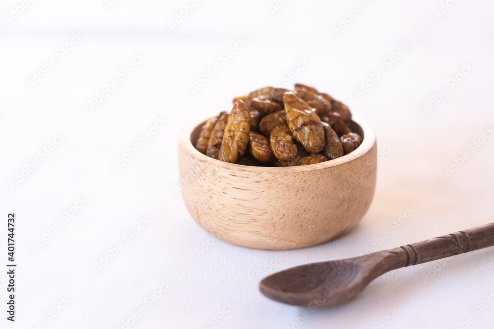 silkworm pupa in wooden bow as edible insects on white background, high ...