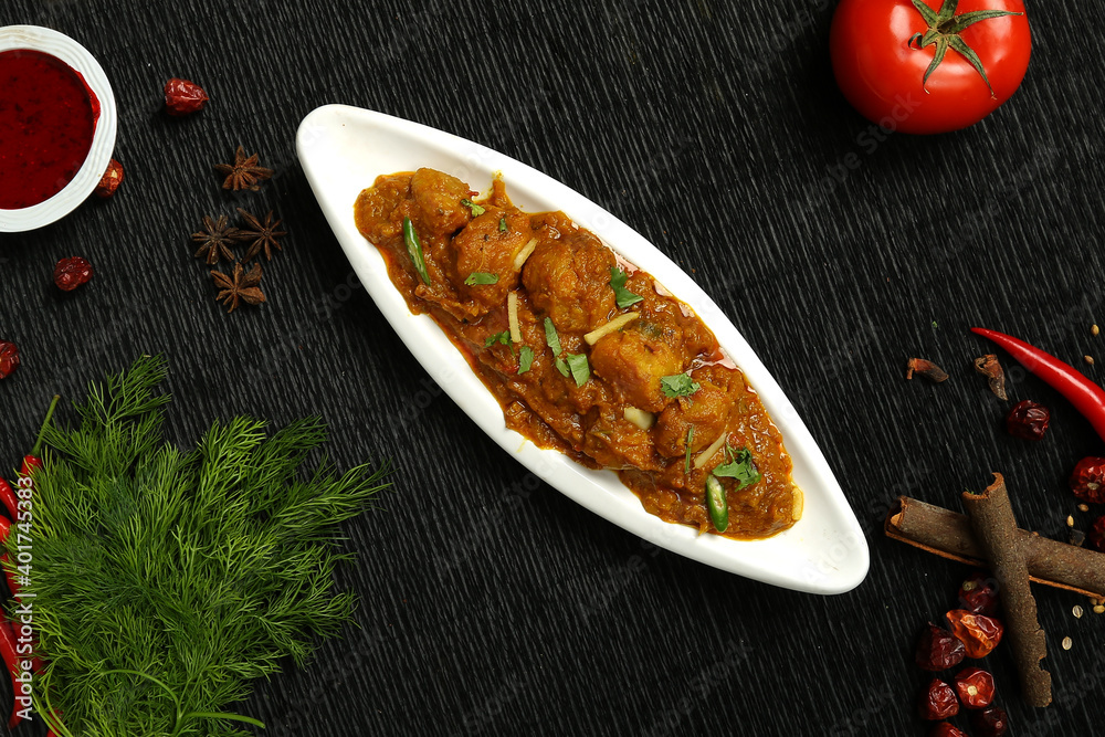 Pakistani North Indian food curry long bowl black background gosht ...