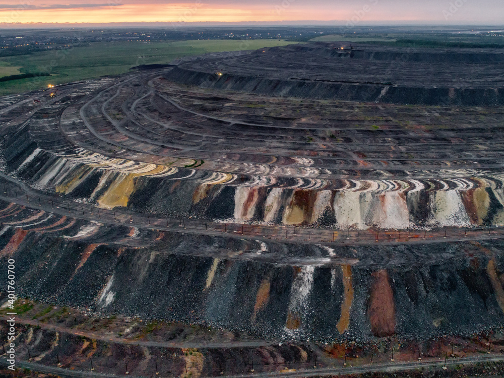 Huge mound of waste rocks. Industrial dump of a mining quarry ...