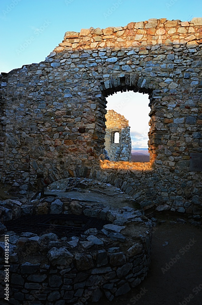 Medieval stone well with remains of wall and castle window on Hrusov ...