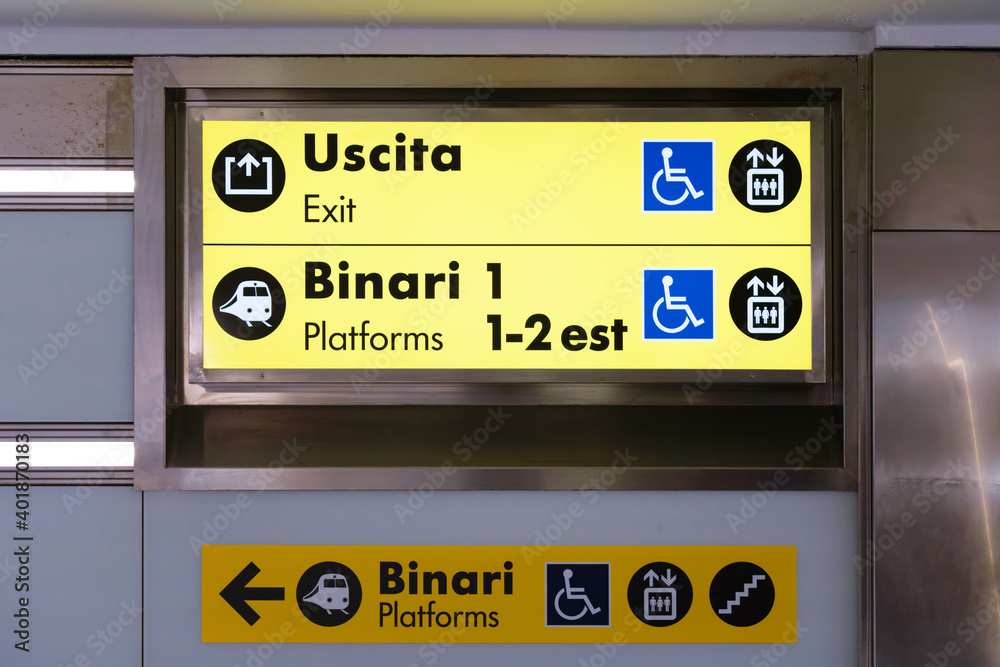 Closeup sign board shows direction to railway train station platform 1 ...