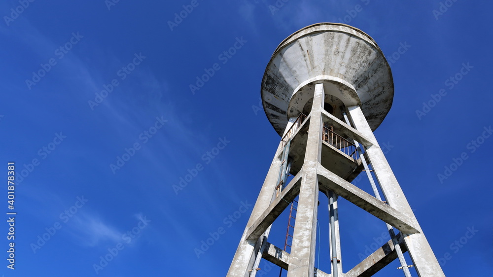 Concrete water tank on a tall tower. Large white storage tank for water ...