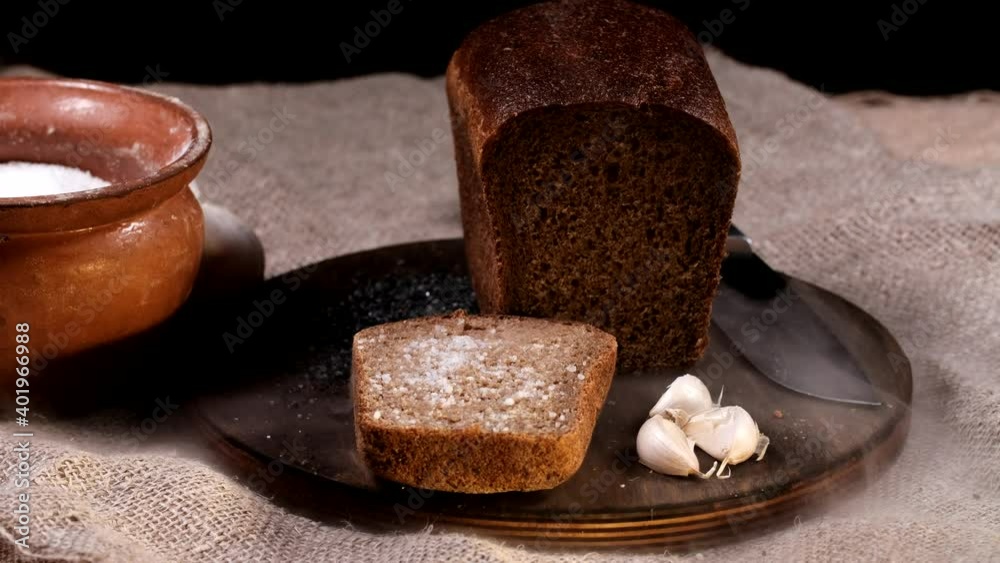 Rye bread. A piece of bread with sable and a clove of garlic on a ...