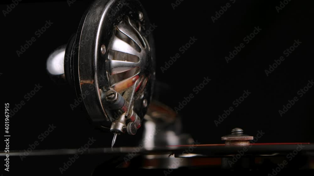 Large needle of a vintage gramophone on rotates vinyl record. Vintage ...