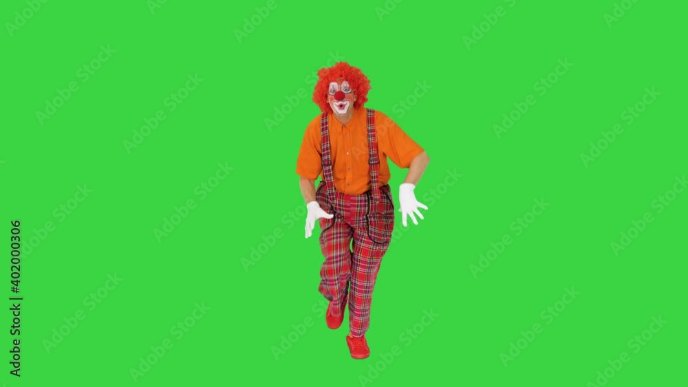 Shh, be quiet Clown making silence gesture while walking on a Green ...