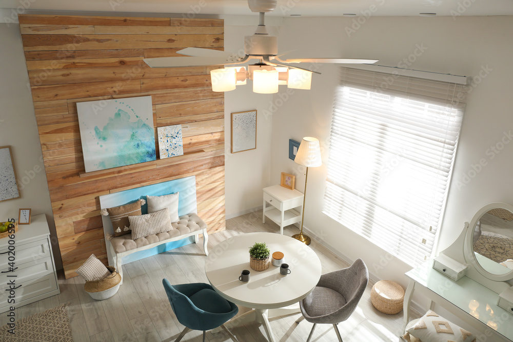 Stylish room interior with modern ceiling fan, view from above Stock ...