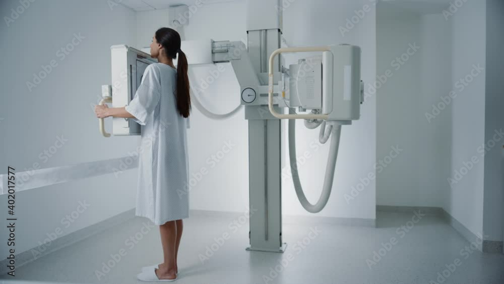 Hospital Radiology Room: Beautiful Multiethnic Woman in Medical Gown ...