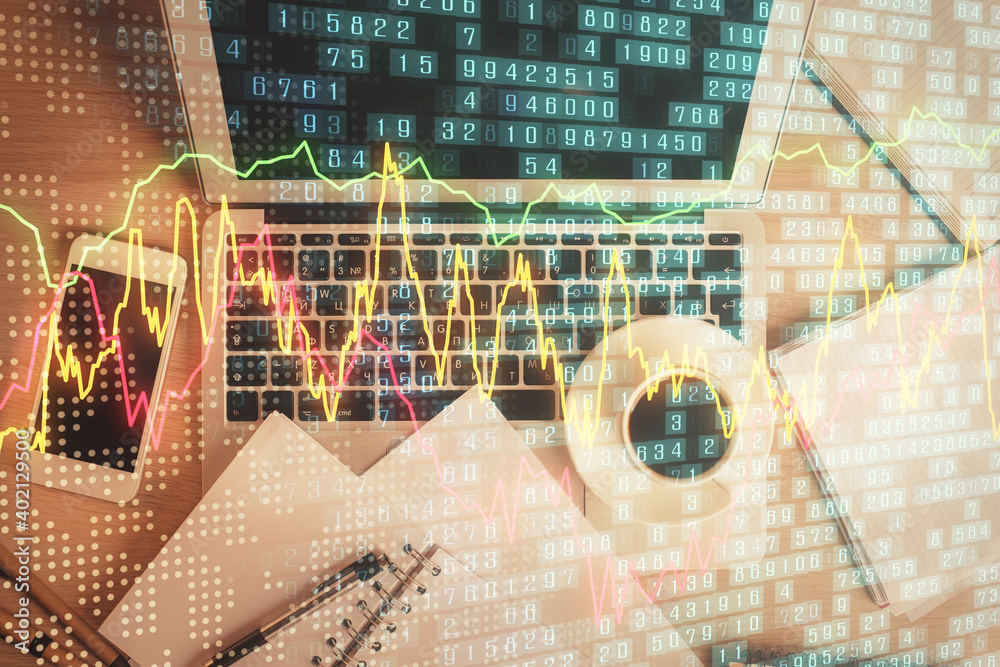 Stock market chart and top view computer on the table background ...