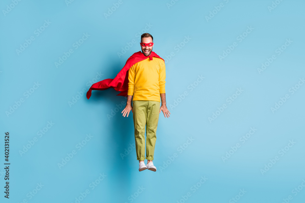 Full length body size photo of superhero in mantle mask jumping high ...