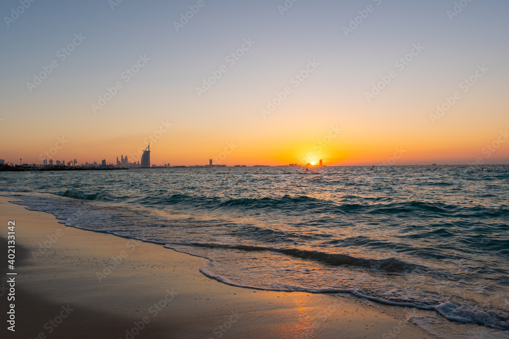 Amazing orange sunset at the beach in Dubai. Beautiful orange colors ...