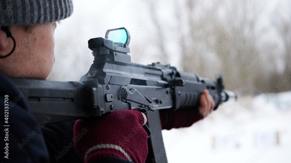 The shooter looks into a Russian or Chinese-made callimator. Shooting ...