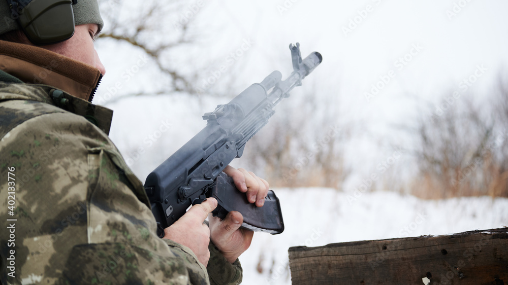 Effective reloading of a Kalashnikov assault rifle in winter in ...