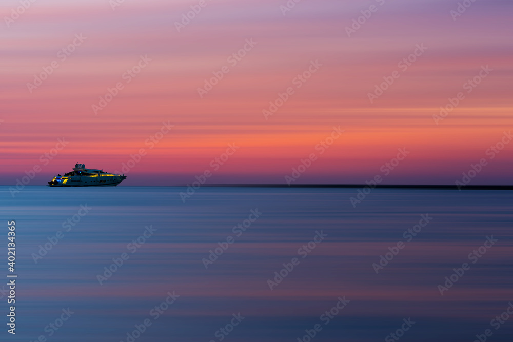 Colorful sea front view sunset with yacht at the horizon line, motion ...