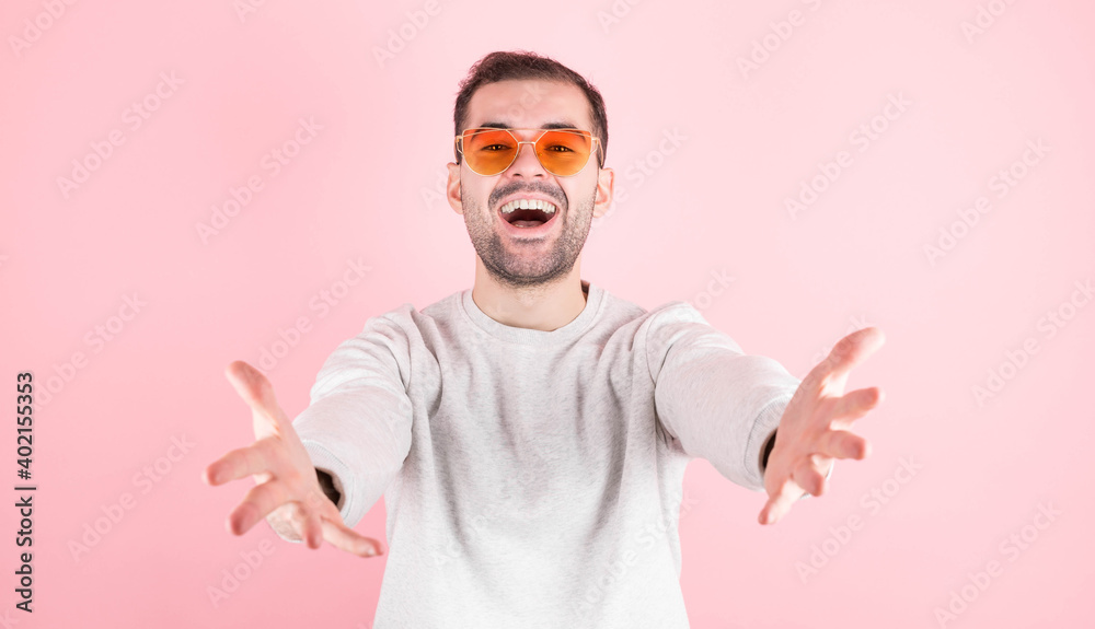 Come to me A portrait of a friendly kind man in a casual white spitshot ...