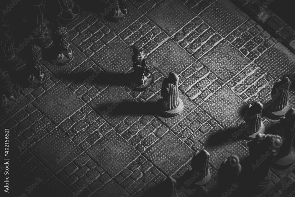 A black and white portrait of two soldier pieces of a match of chess ...