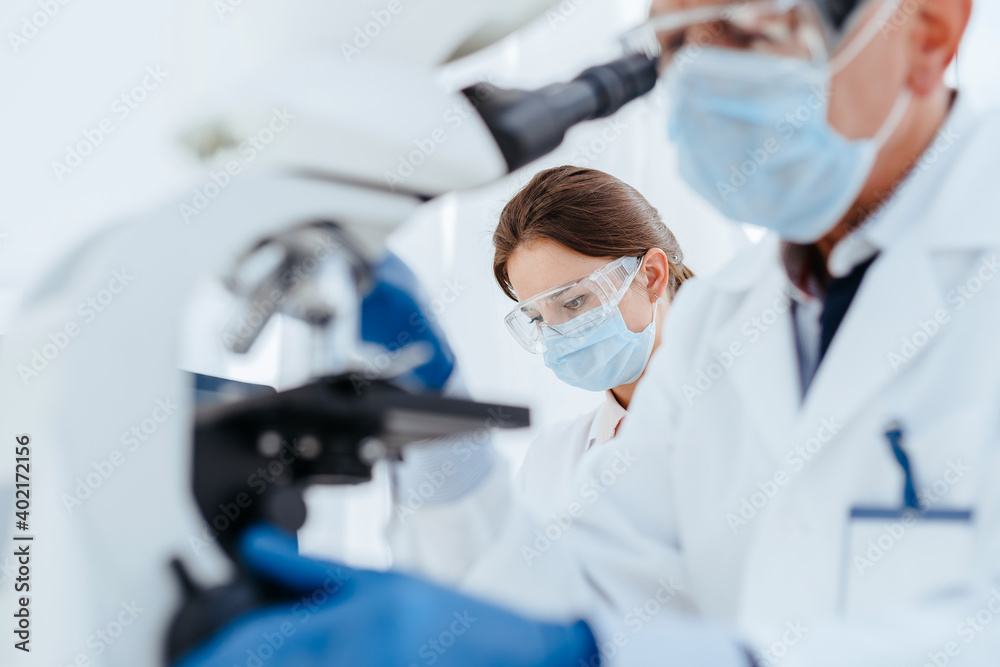 image of a group of scientists working conducting research in a medical ...