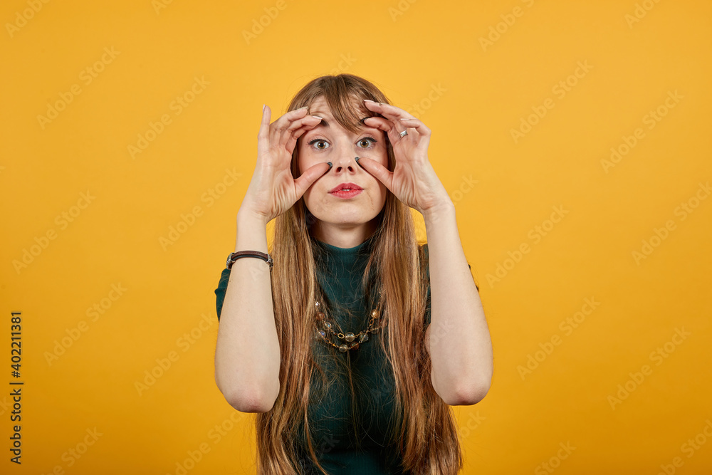 Young trying to open eyes with fingers, sleepy, tired for morning ...