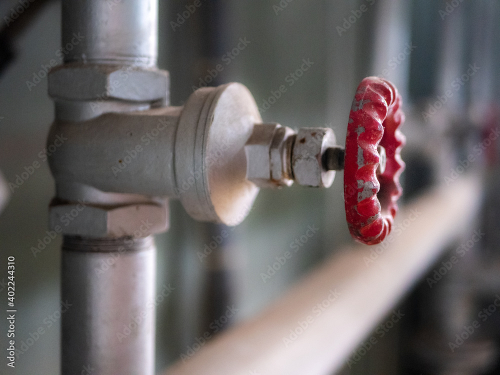 Old red brass gate valve in close Stock Photo | Adobe Stock