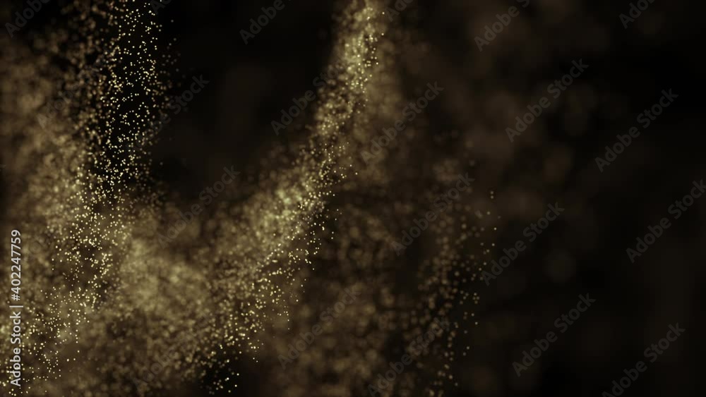 Gold dust particles fly in slow motion in the air lingering slowly ...